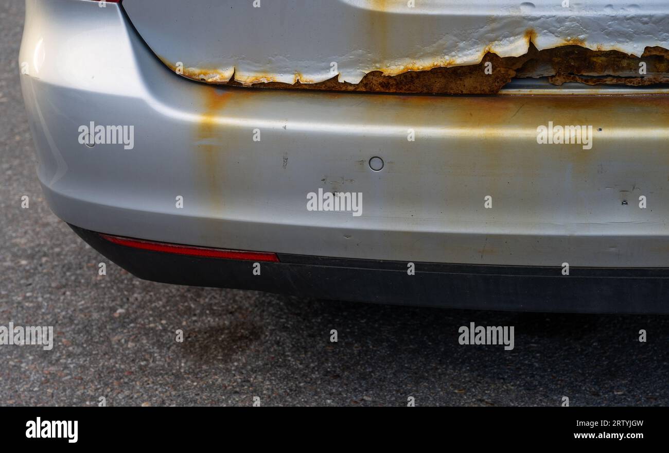 Rusty rear hatch of a grey car Stock Photo - Alamy