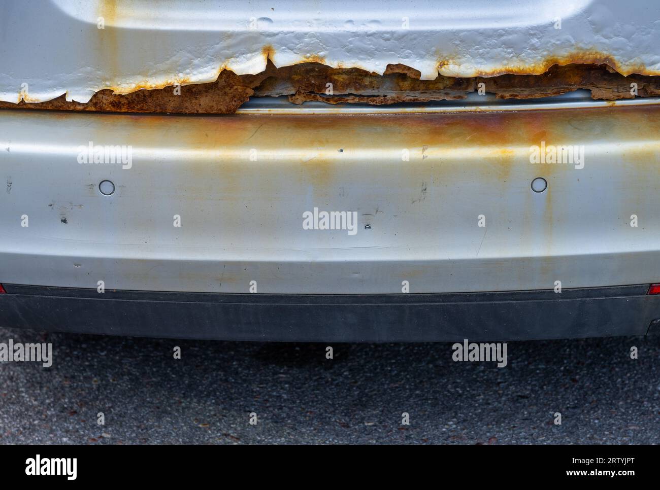Rusty rear hatch of a grey car Stock Photo - Alamy
