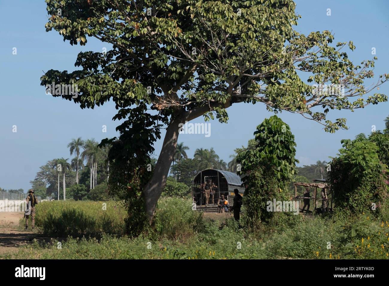 Dominican Republic soldiers patrol near the bank of the Massacre River ...