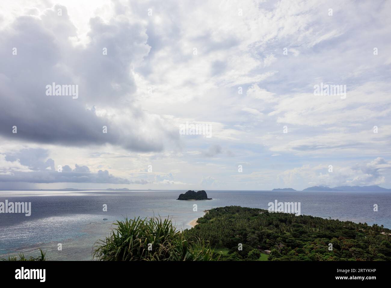 little vomo island, fiji, under blue sky Stock Photo - Alamy