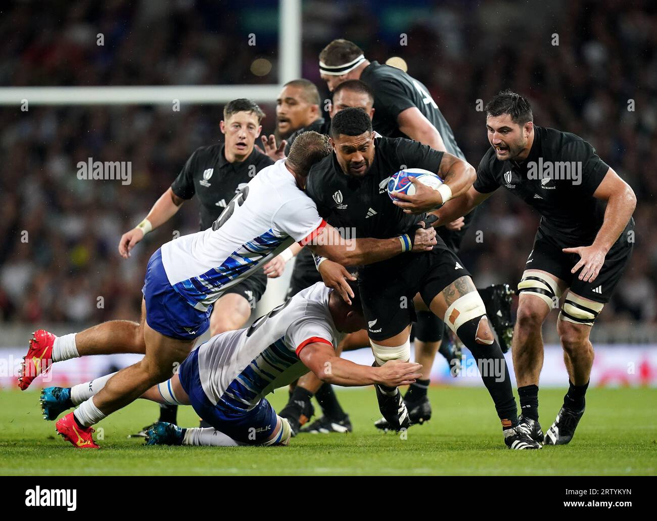 New Zealand's Ardie Savea evades a tackle from Namibia's Wian Conradie ...