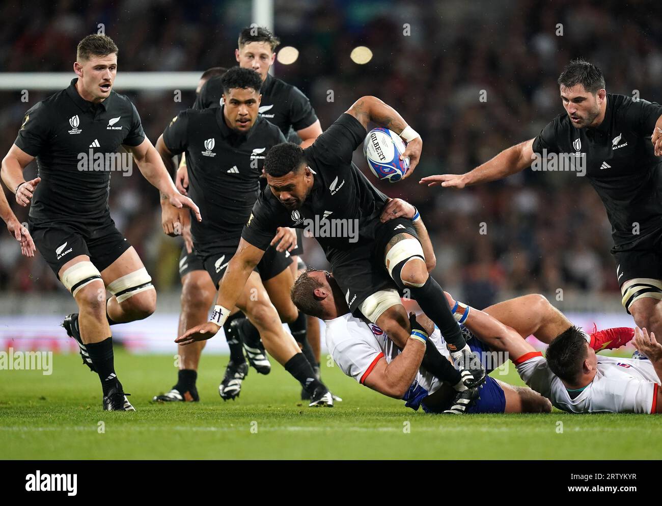 New Zealand's Ardie Savea evades a tackle from Namibia's Wian Conradie ...