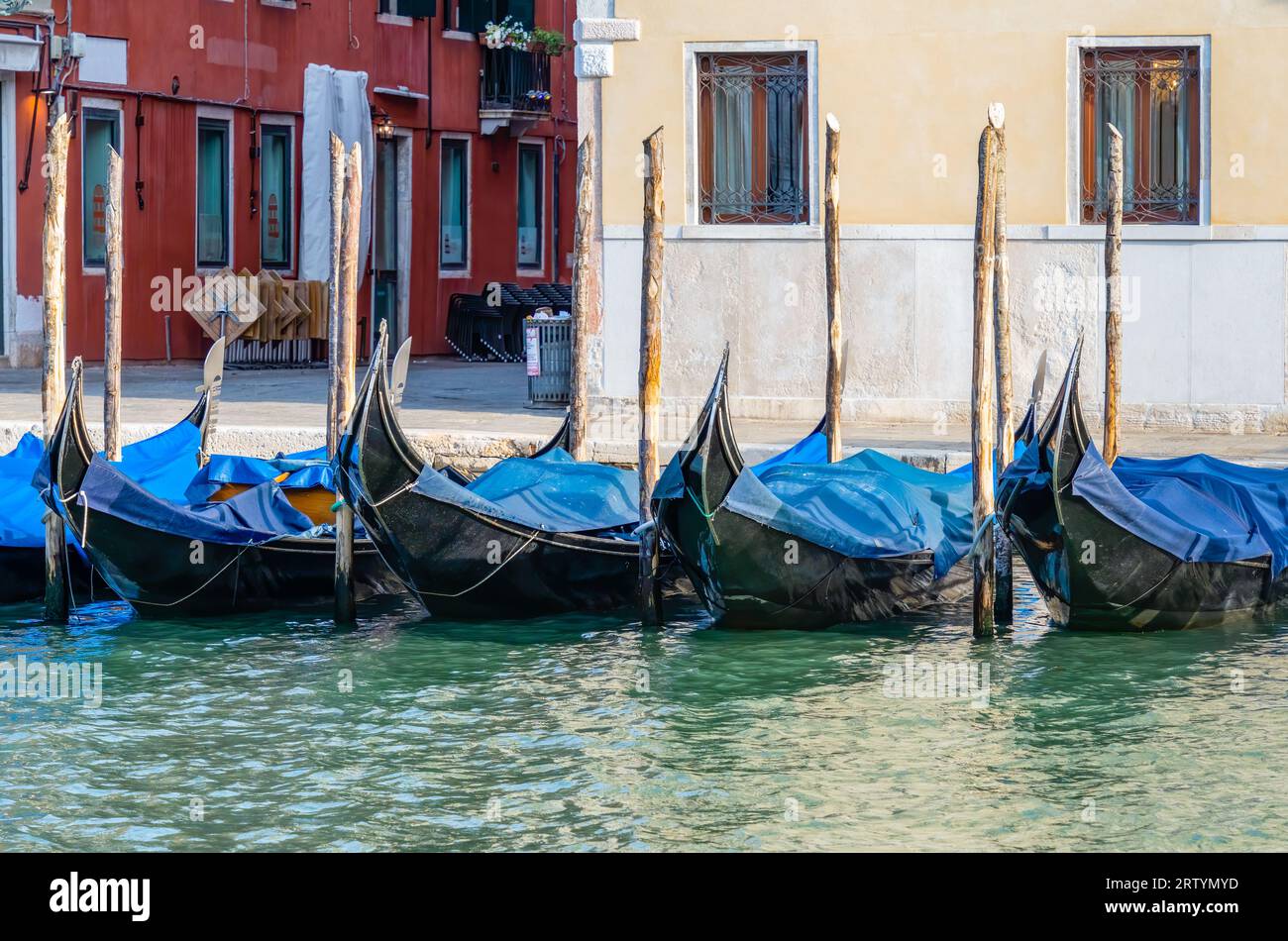 Long gondolas moored lagoon pier hi-res stock photography and images ...