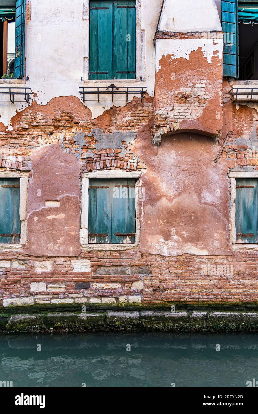 Old medieval worn out brick wall building in Venice, Italy Stock Photo ...