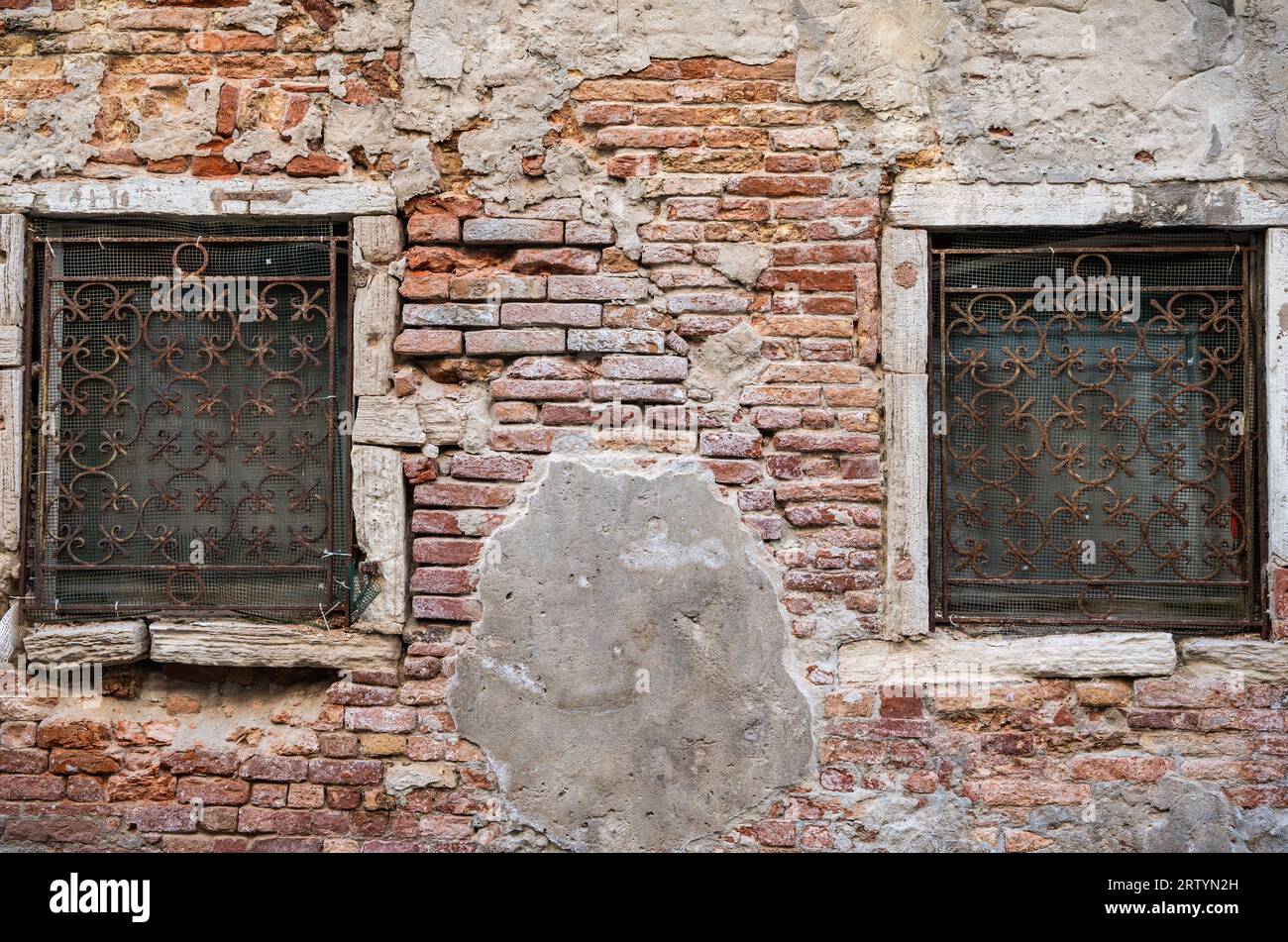 Old medieval worn out brick wall building in Venice, Italy Stock Photo ...