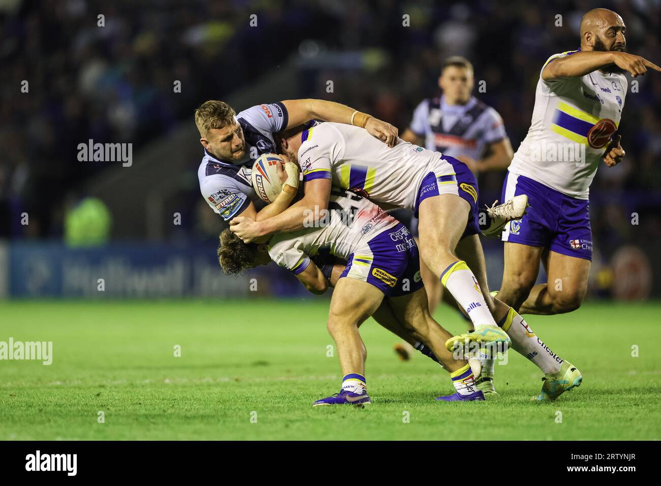 Warrington, UK. 15th Sep, 2023. Matty Lees #10 of St Helens is tackled ...