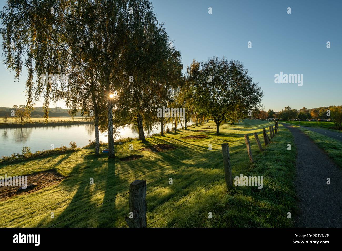 Landscape during sunrise, autumn, trees on the river Stock Photo - Alamy