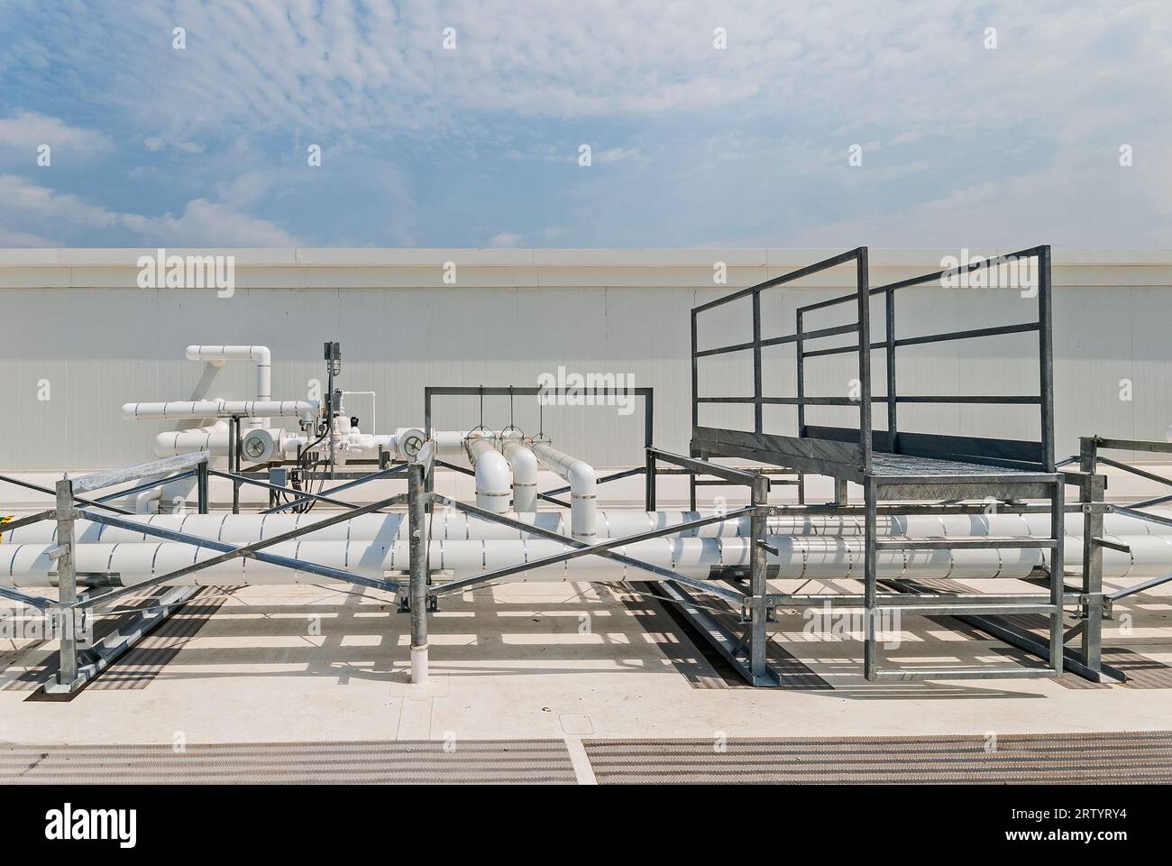 Insulated piping on the roof of an ammonia cycle industrial ...