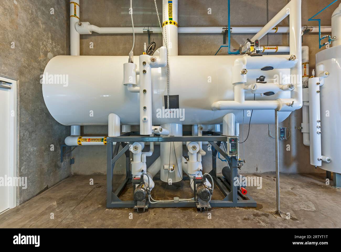 A horizontal tank in an ammonia-cycle industrial refrigeration cold ...