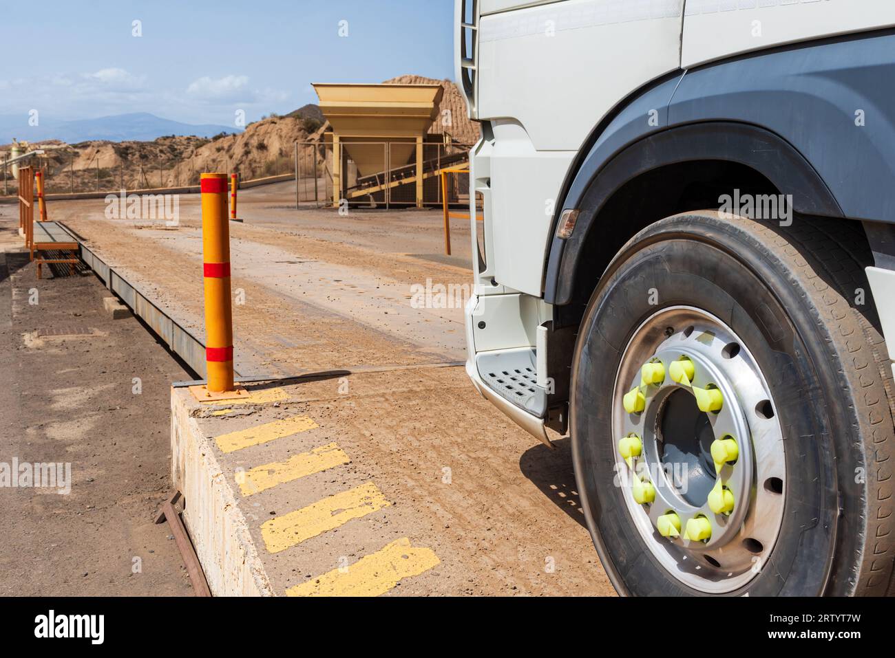 Truck entering a weighing scale in a quarry Stock Photo - Alamy