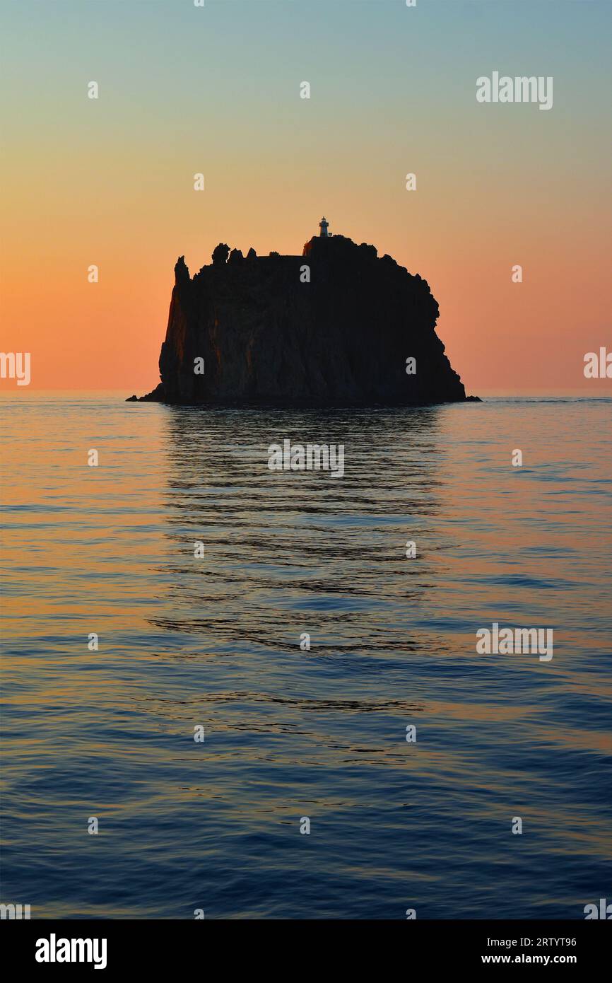 Strombolicchio with lighthouse, sunset at the island, Stromboli ...