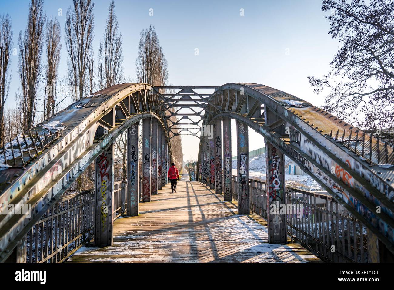 man walking over bridge in winter Stock Photo - Alamy