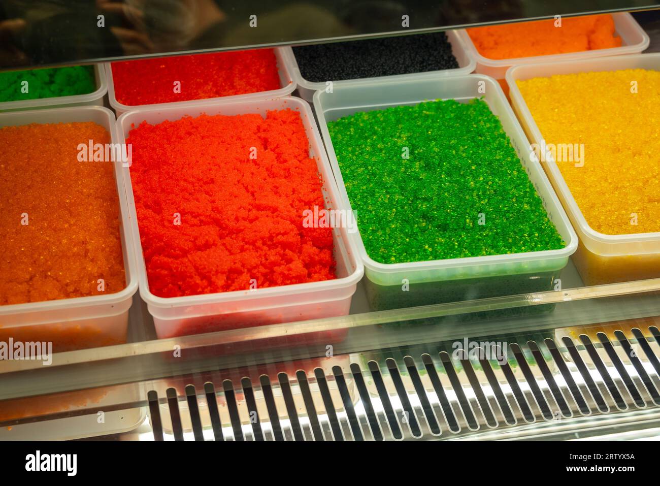 Close-up of containers with masaga caviar of different colors Stock ...
