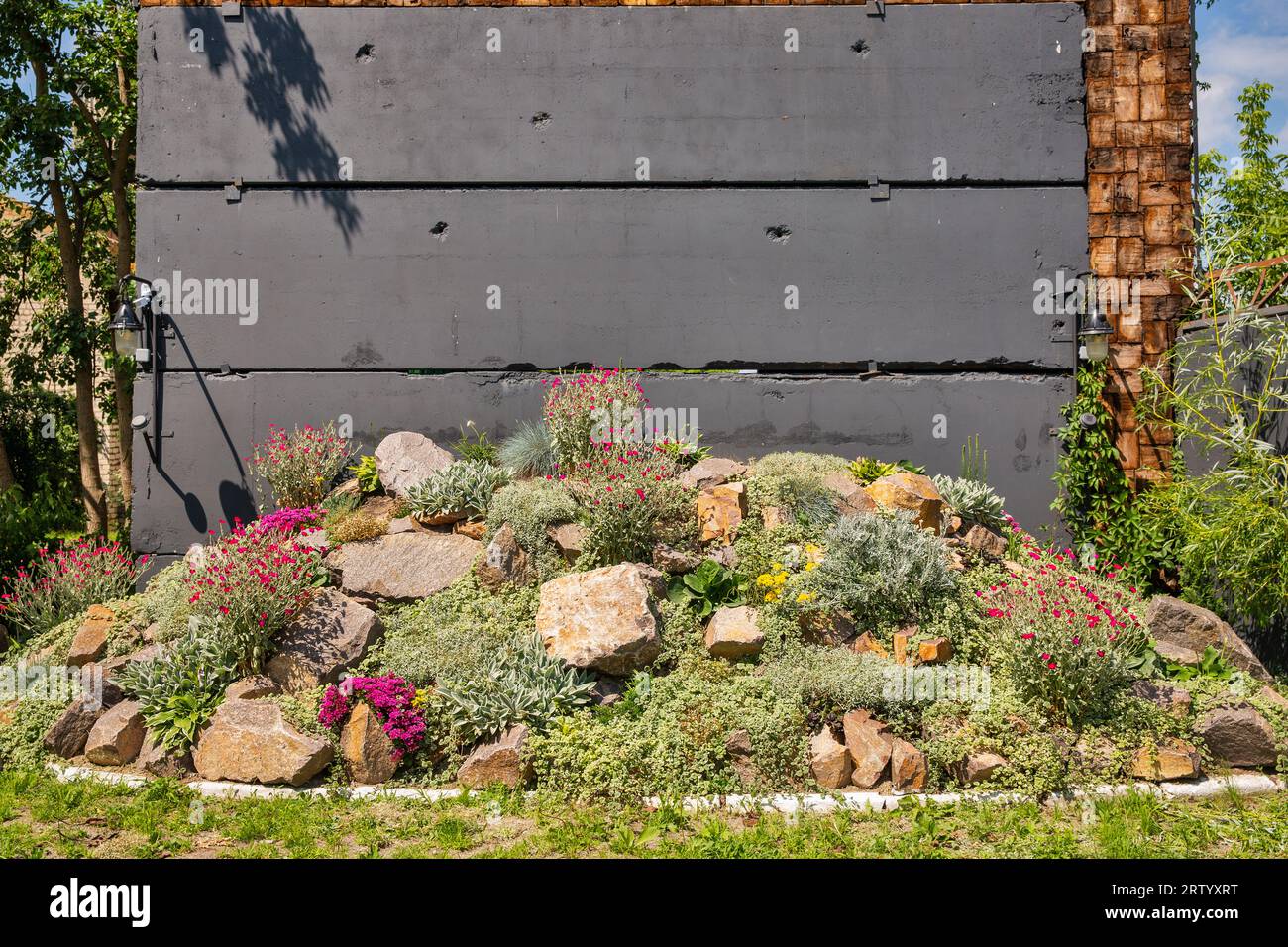 Alpine slide with with black wall and lamps Stock Photo - Alamy