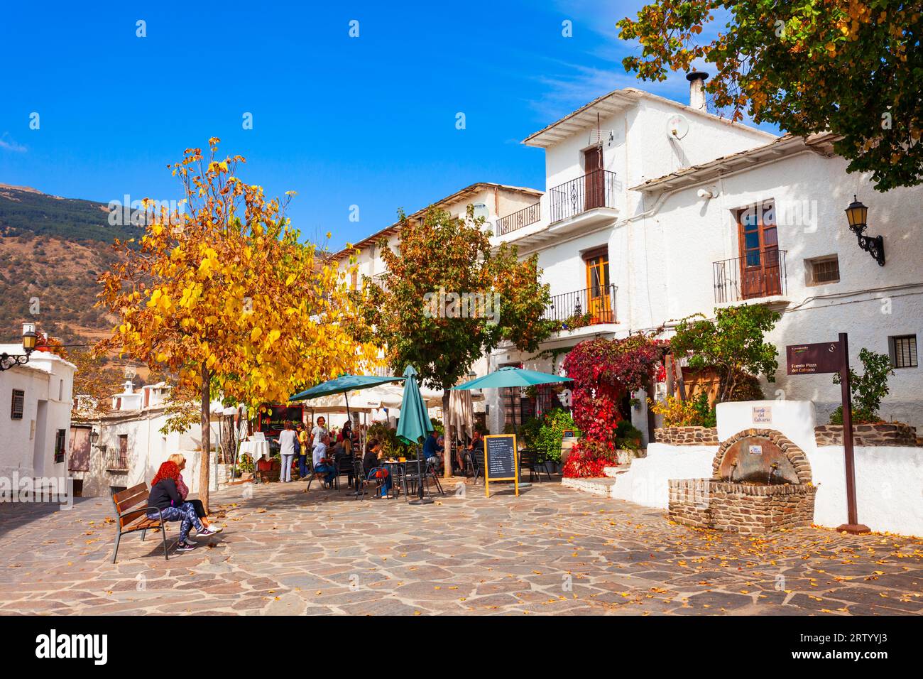 Capileira, Spain - October 21, 2021: Fountain at Plaza Calvario square ...