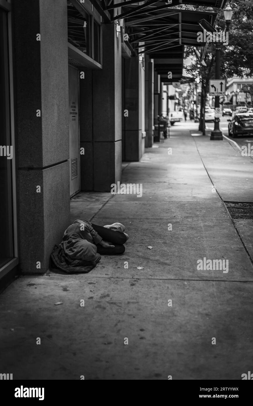 Black and white pic of homeless person with no belongings sleeping on ...