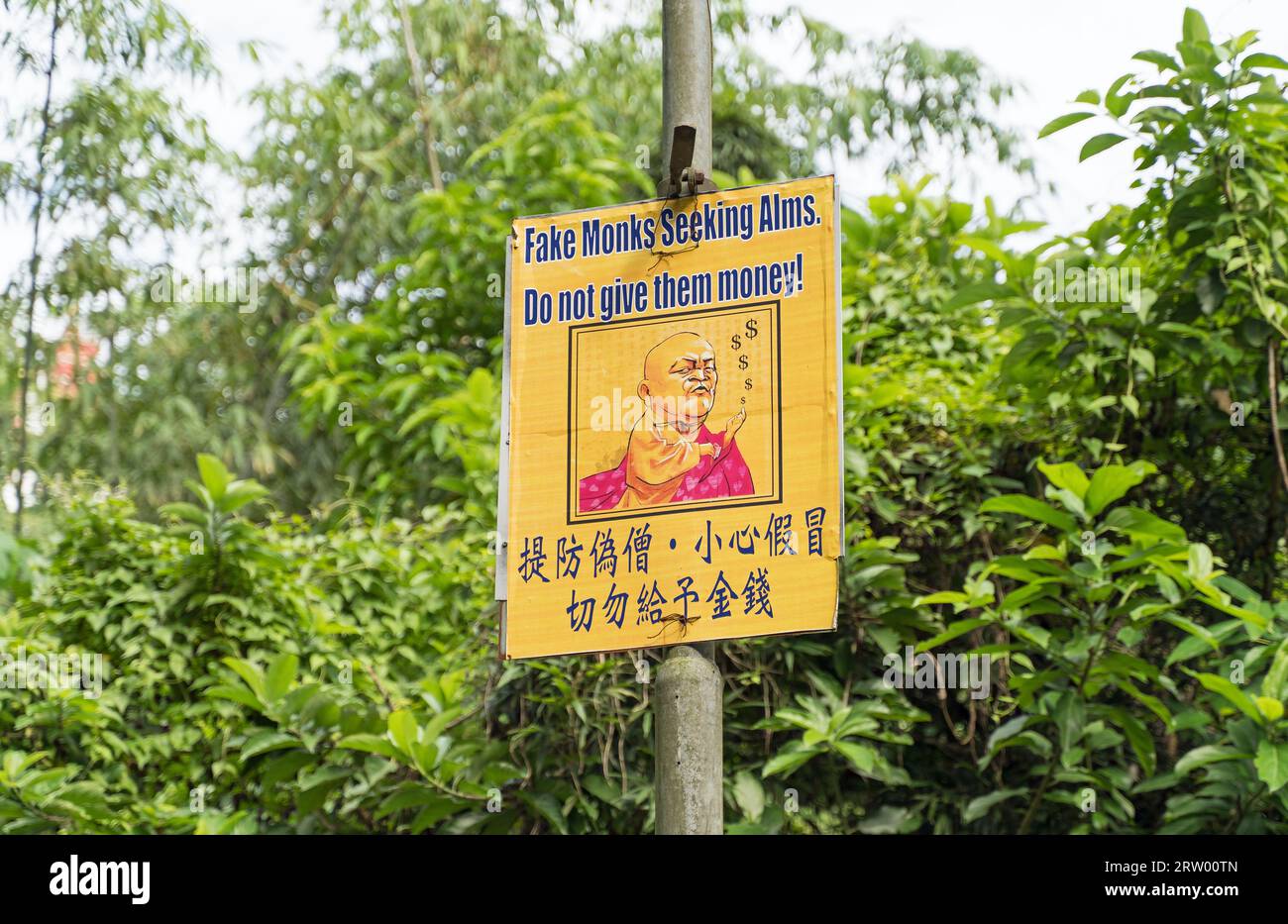 A warning sign at the entrance of the Ten Thousand Buddhas Monastery in ...