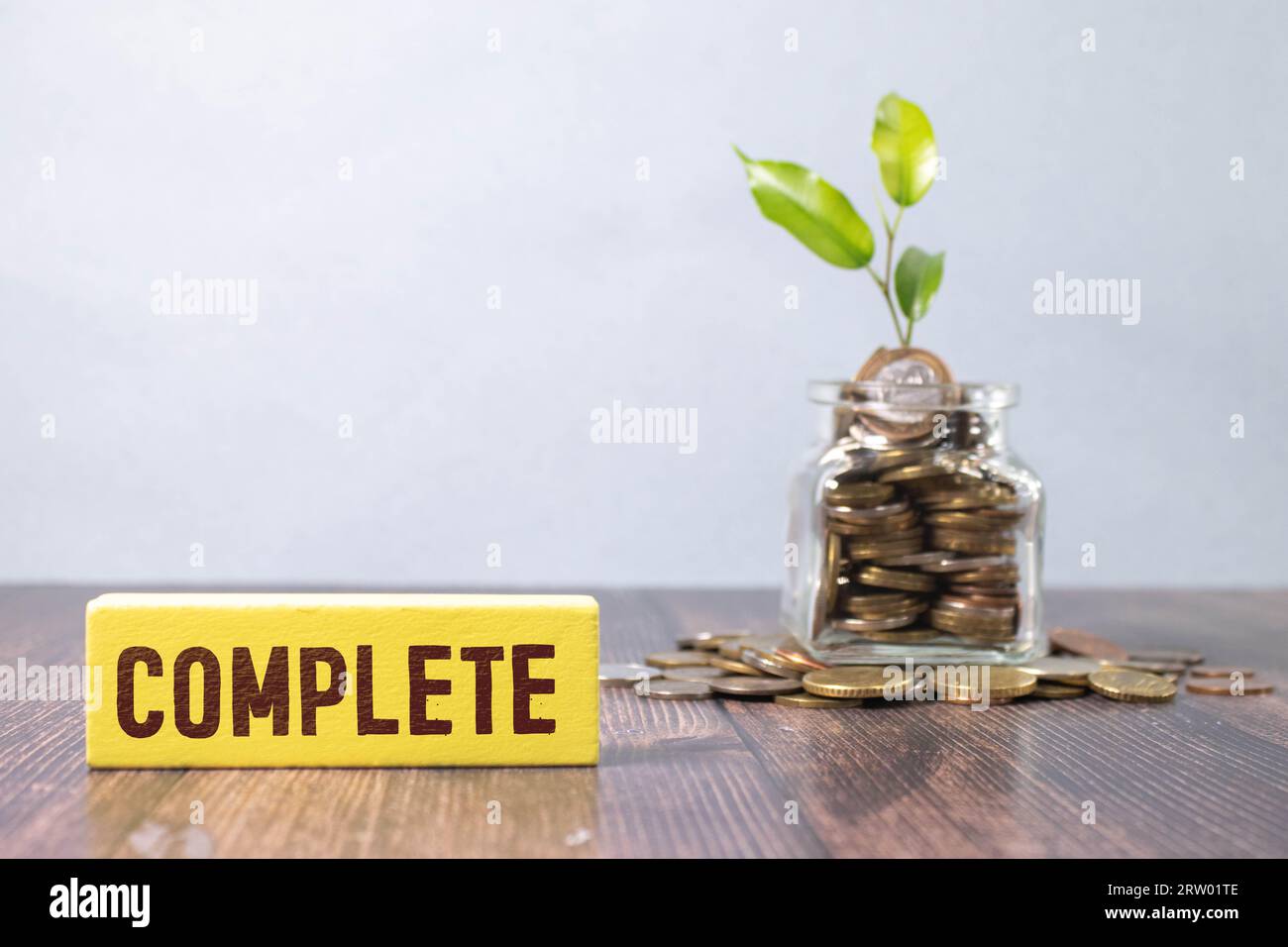 Black color banner that have embossed letter with word complete on ...