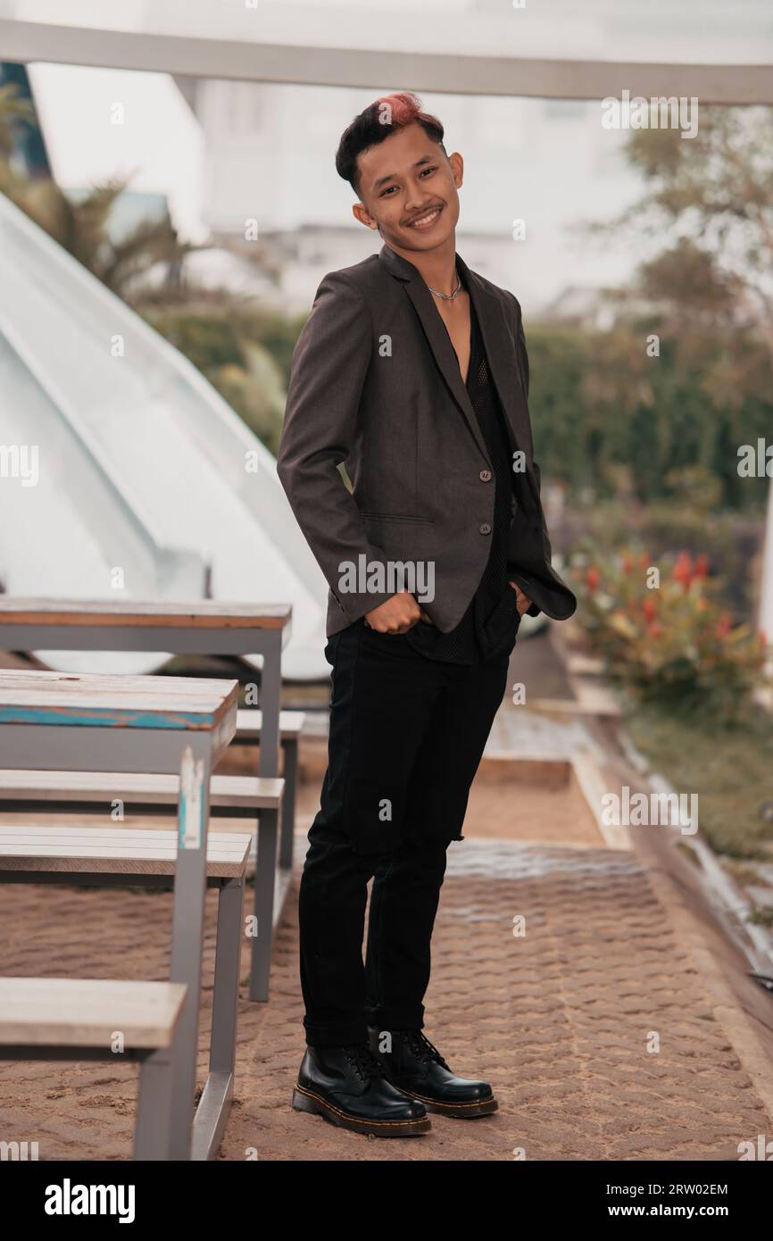 a mature man in a gray suit and blond hair enters the office in ...