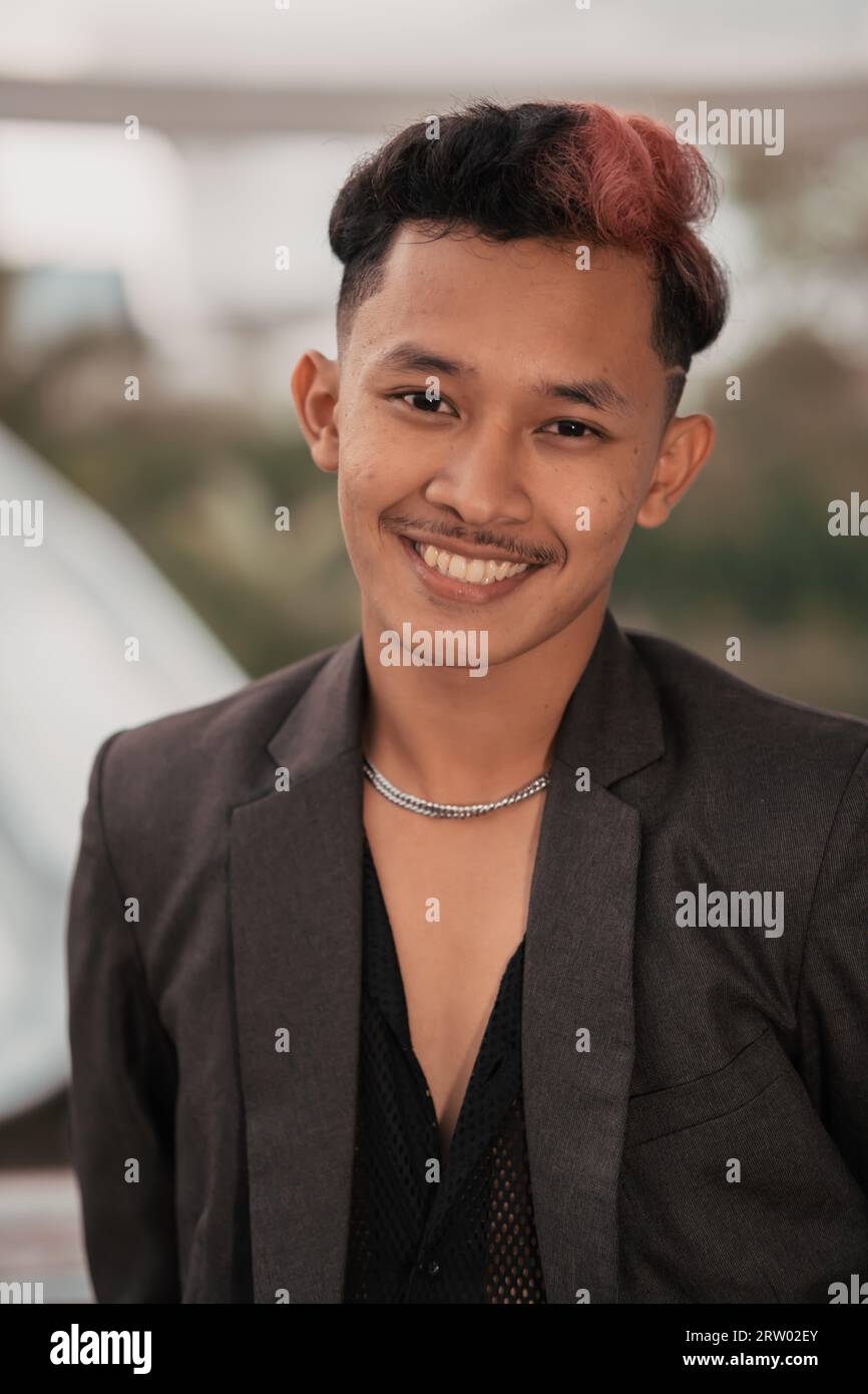 a mature man in a gray suit and blond hair enters the office in ...