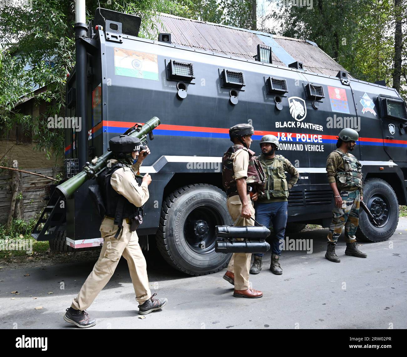 ANANTNAG, INDIA - SEPTEMBER 15: Policemen carry ammunitions as they ...