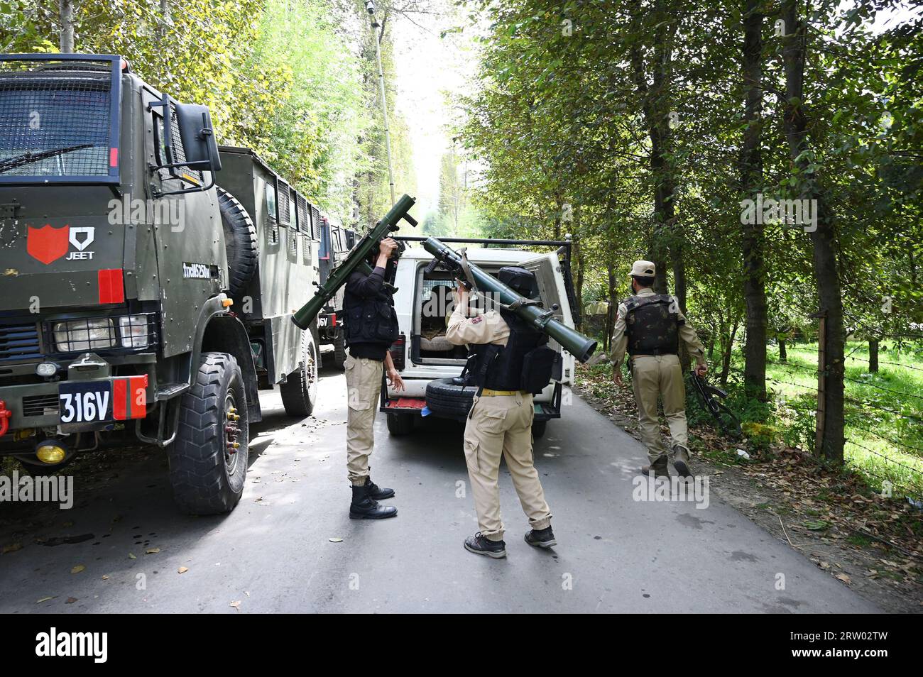 ANANTNAG, INDIA - SEPTEMBER 15: Policemen carry ammunitions as they ...