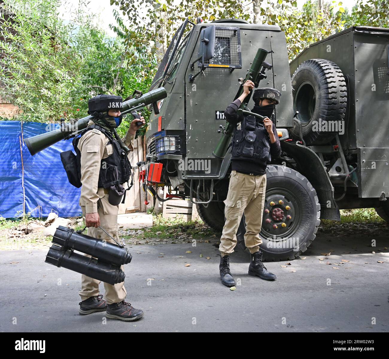ANANTNAG, INDIA - SEPTEMBER 15: Policemen carry ammunitions as they ...
