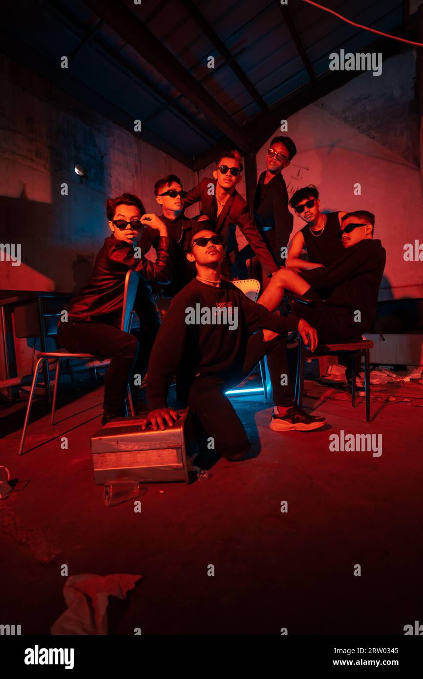 a group of delinquent teenagers wearing glasses and black clothes were ...