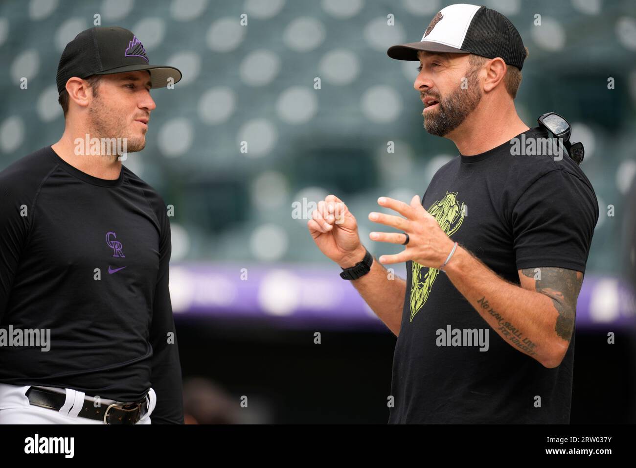 Colorado Rockies starting pitcher Ty Blach, left, chats with retired ...