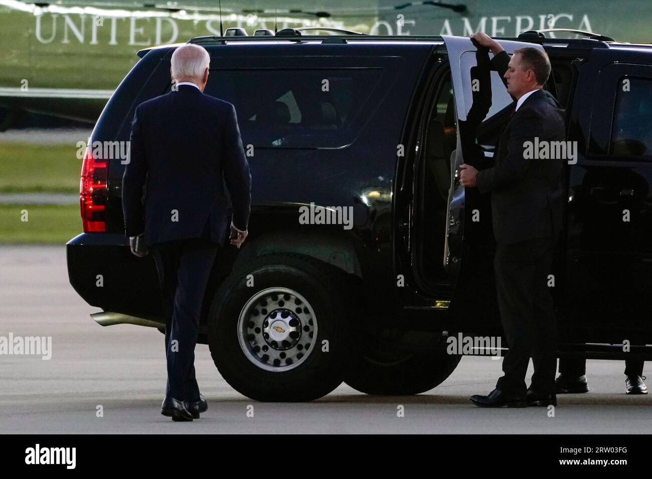 President Joe Biden walks to his motorcade after arriving at Delaware ...