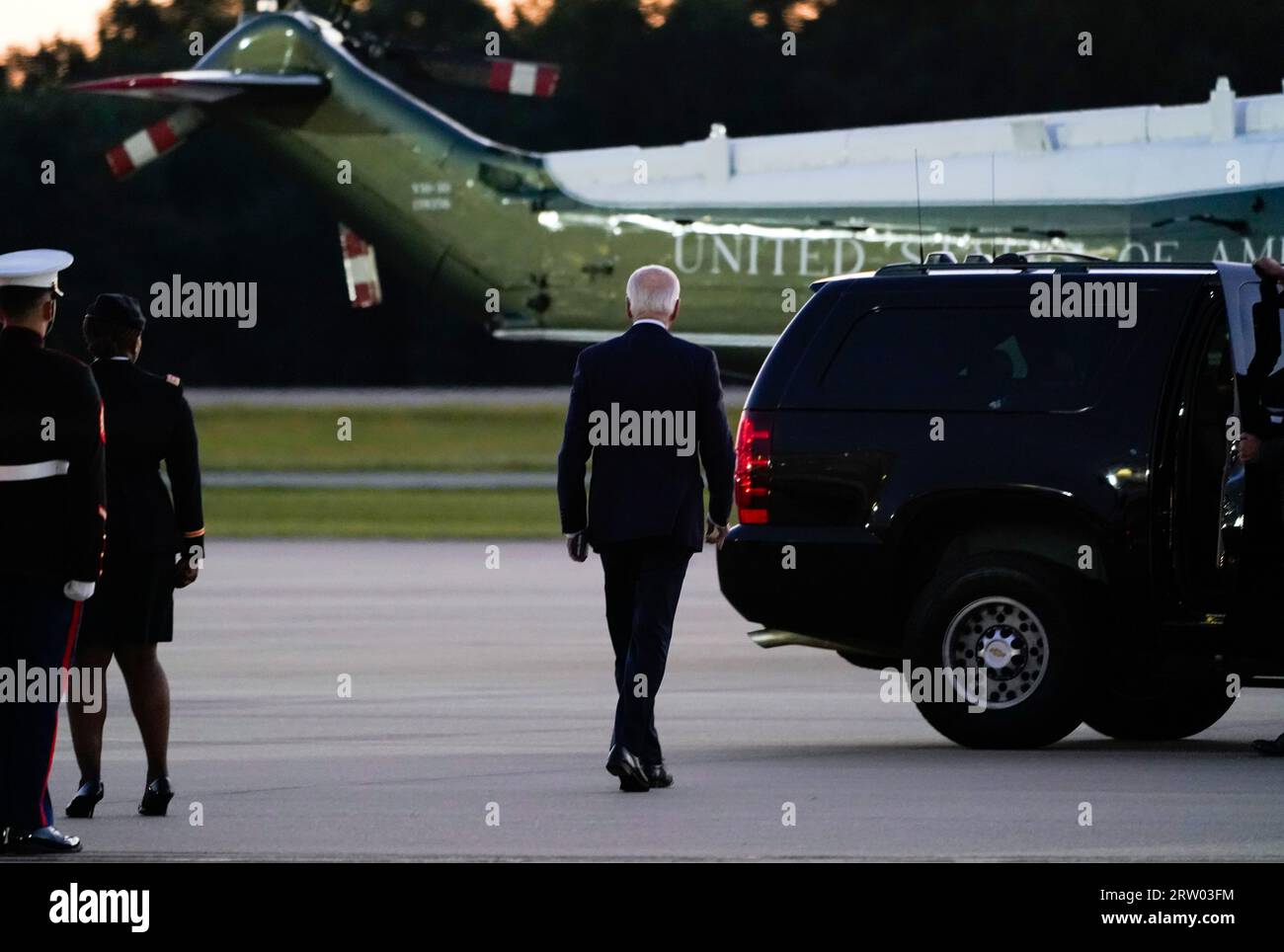 President Joe Biden walks to his motorcade after arriving at Delaware ...