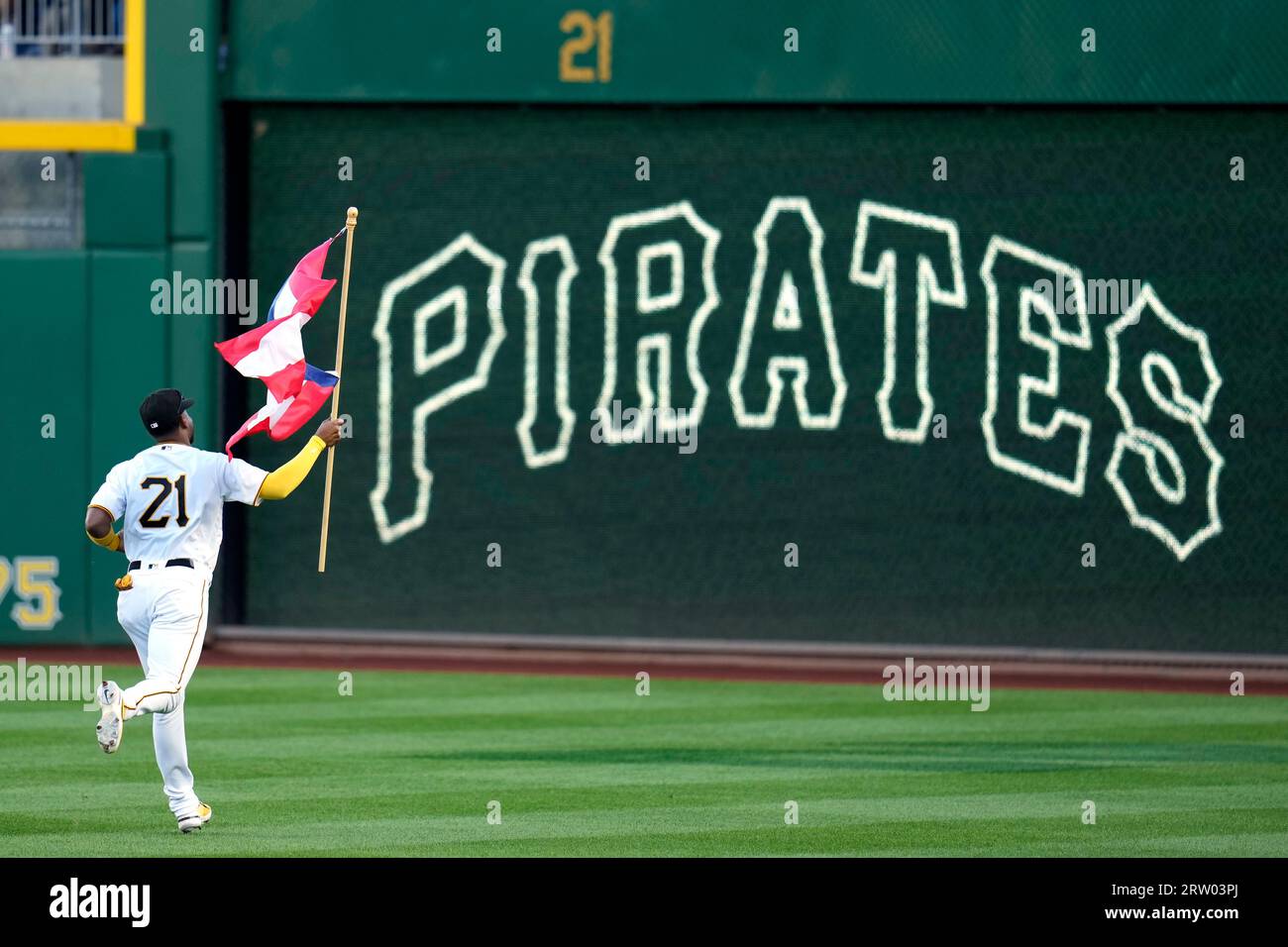 Pittsburgh Pirates right fielder Joshua Palacios carries a Puerto Rican ...