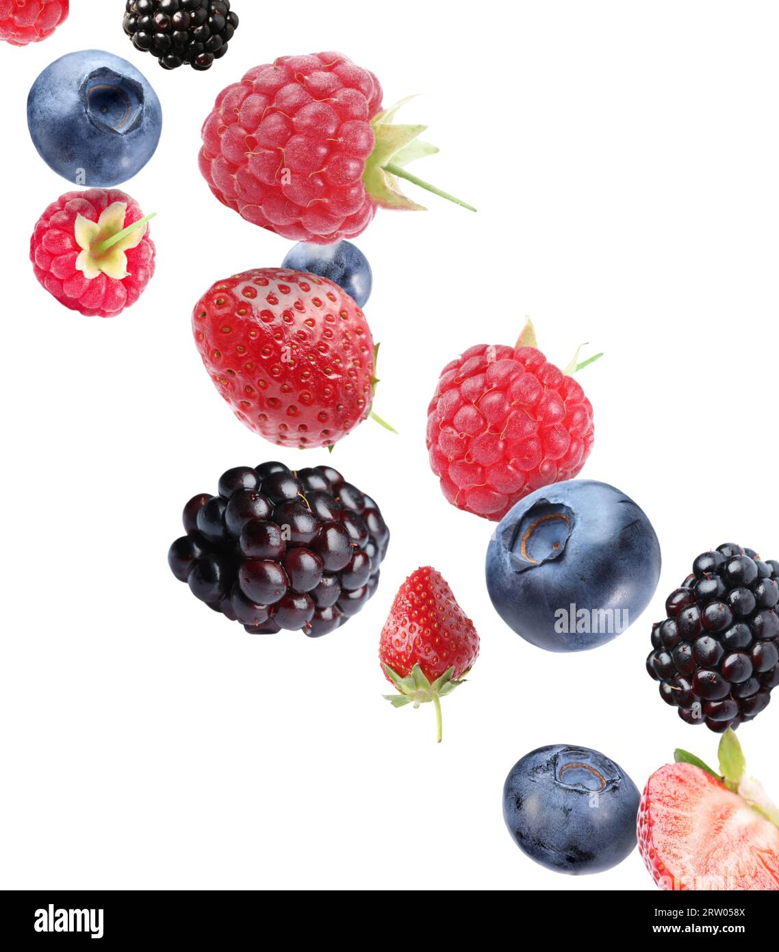 Many different berries flying on white background Stock Photo - Alamy