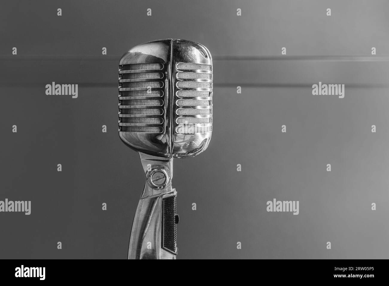 Singer holding the microphone Black and White Stock Photos & Images - Alamy
