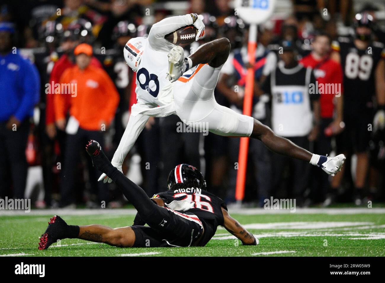 Virginia wide receiver Malachi Fields (8) gets upended by Maryland ...