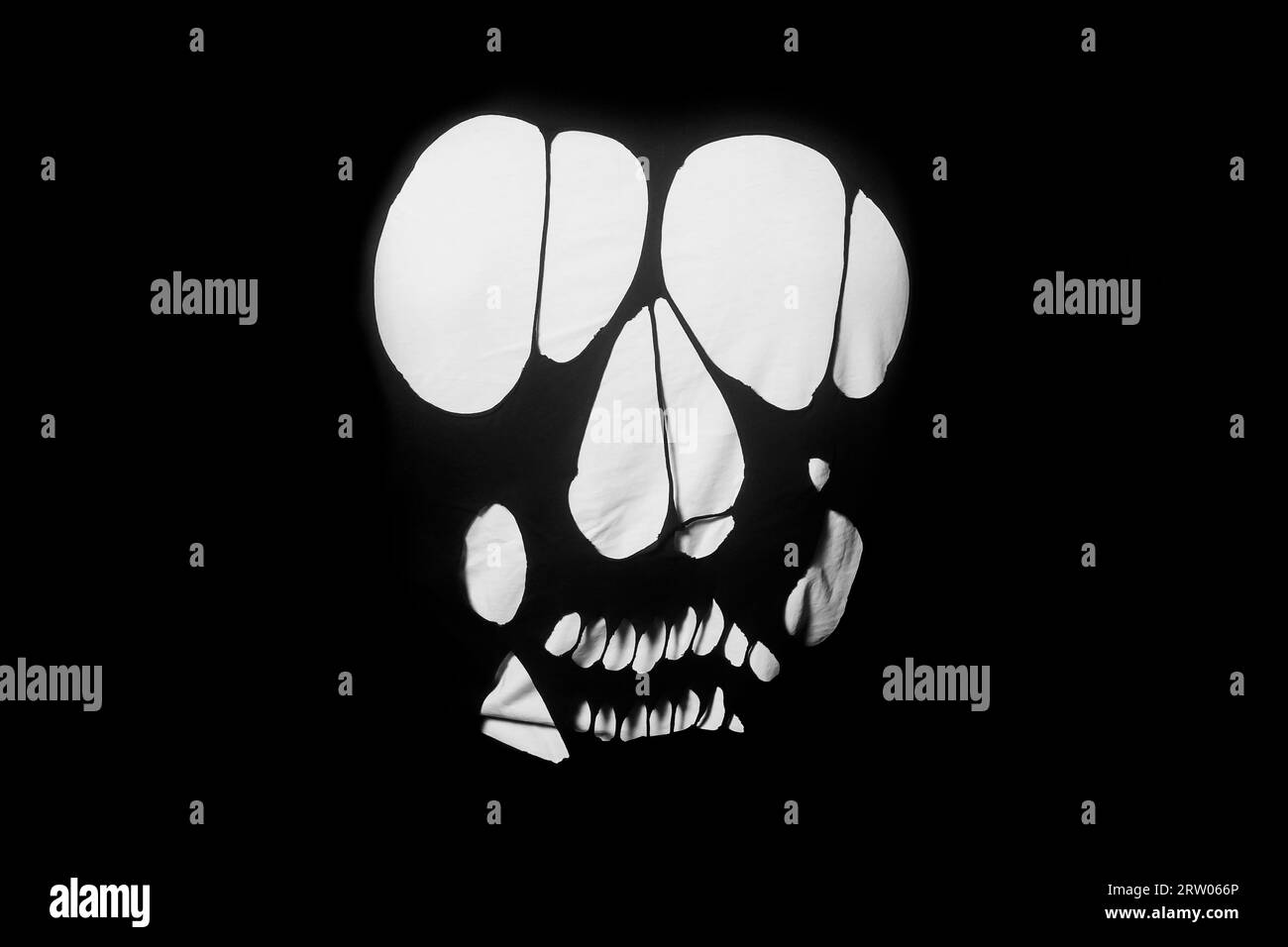 Scary frightening face eyes, nose, teeth, white skull, black background ...