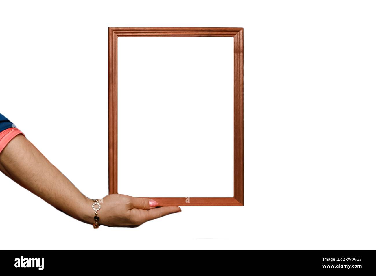 Adult women hand keeps at a blank white space frame mock up for text ...