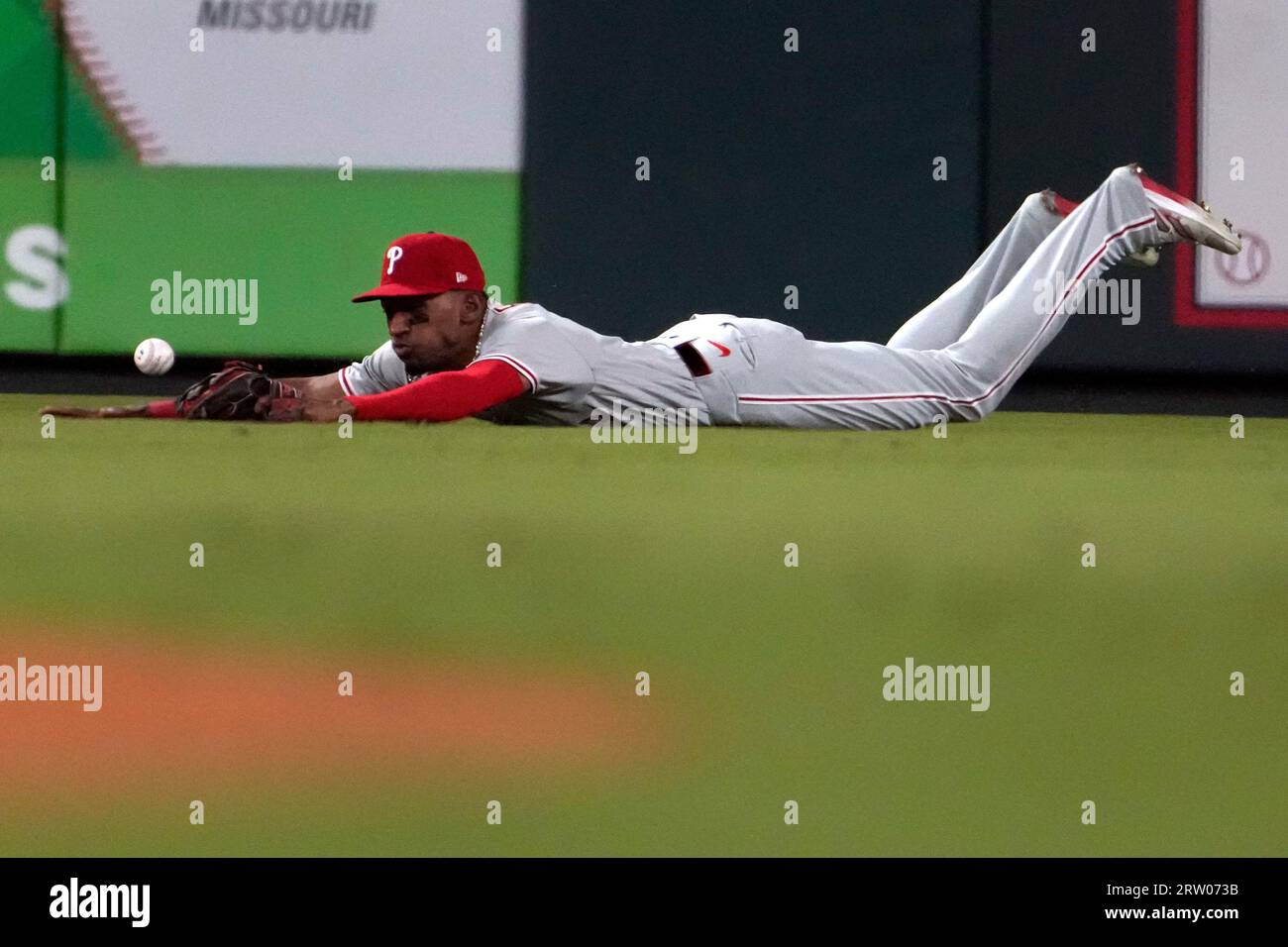 Philadelphia Phillies center fielder Johan Rojas is unable to catch a ...