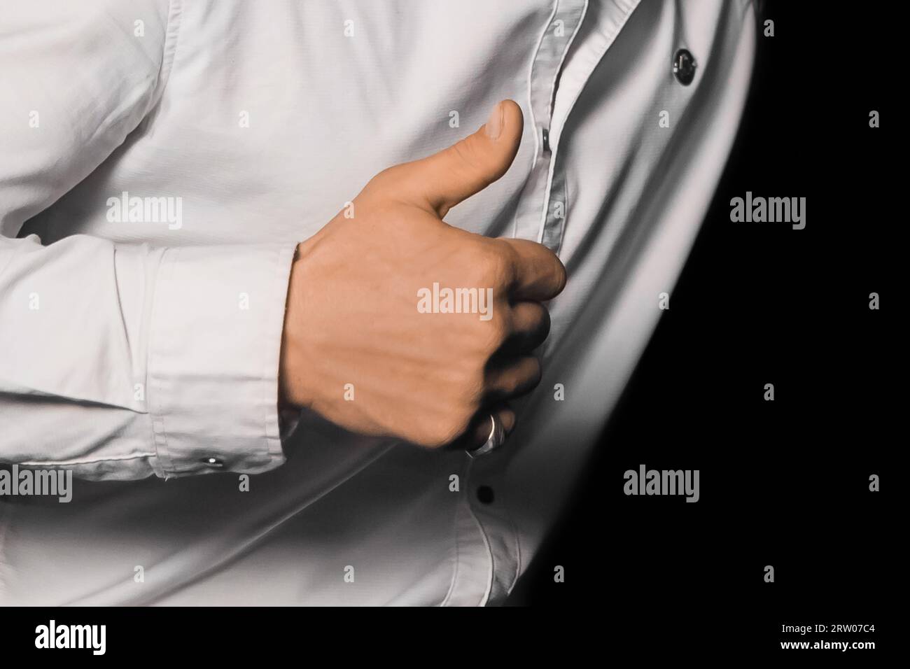 Guy's hand shows class cool thumb top close-up Stock Photo - Alamy