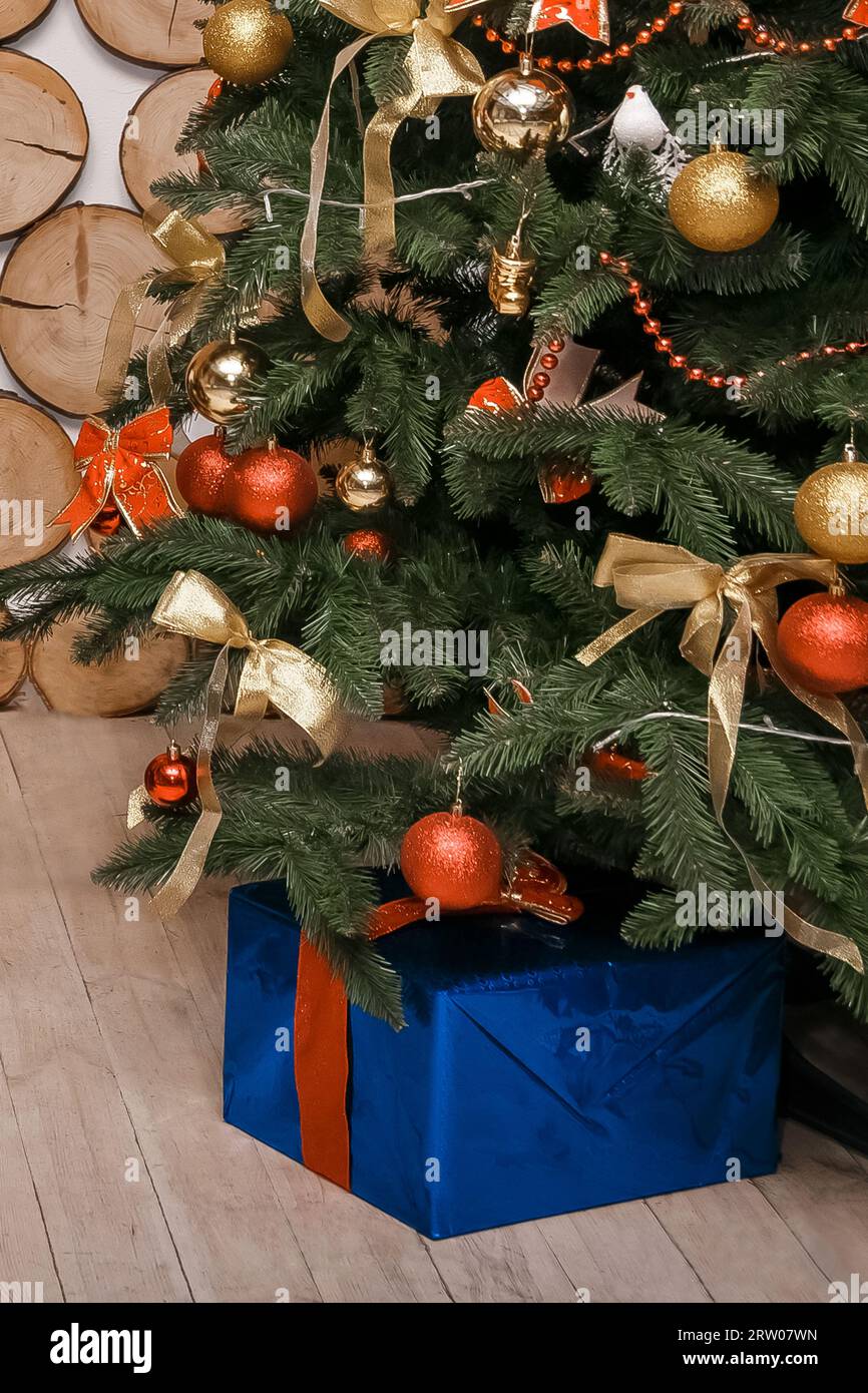 A gift in a blue wrapper for the New Year under the New Year's ...