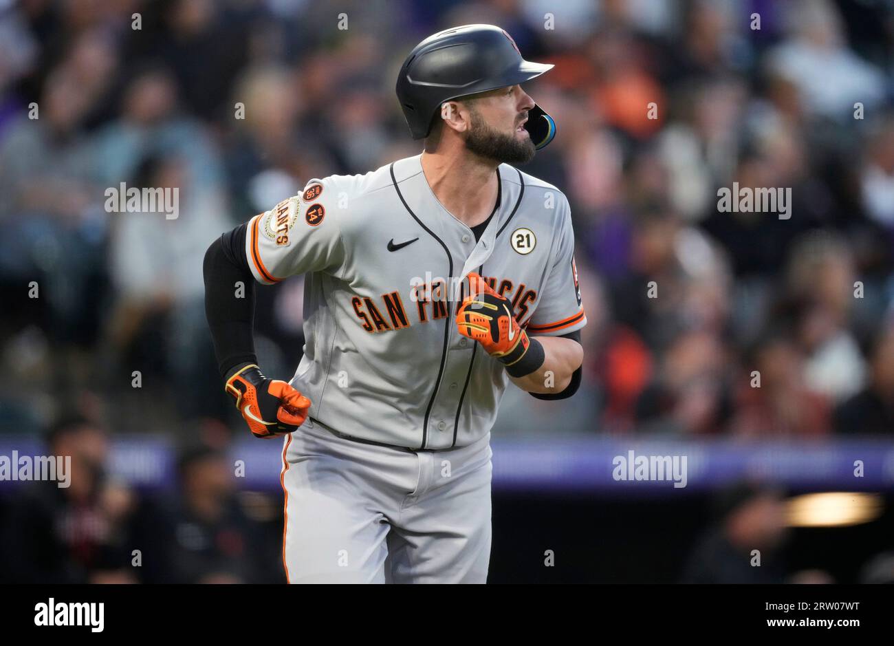 San Francisco Giants' Mitch Haniger watches his sacrifice fly against ...