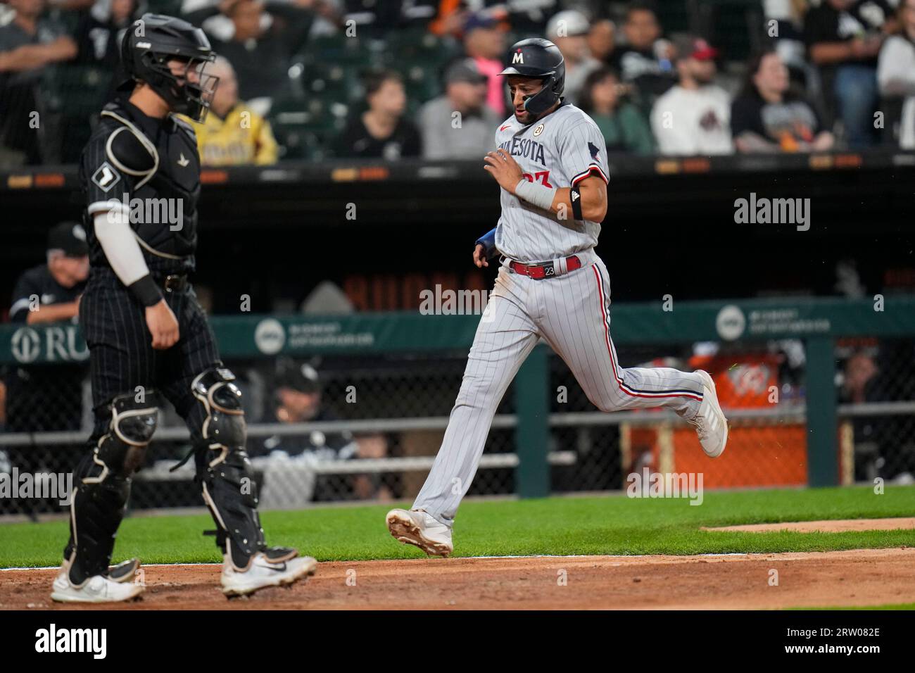 Minnesota Twins' Royce Lewis, right, jogs past Chicago White Sox ...