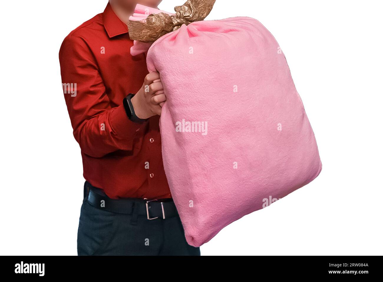 The boy is holding a pink soft bag with New Year's gifts or toys and ...