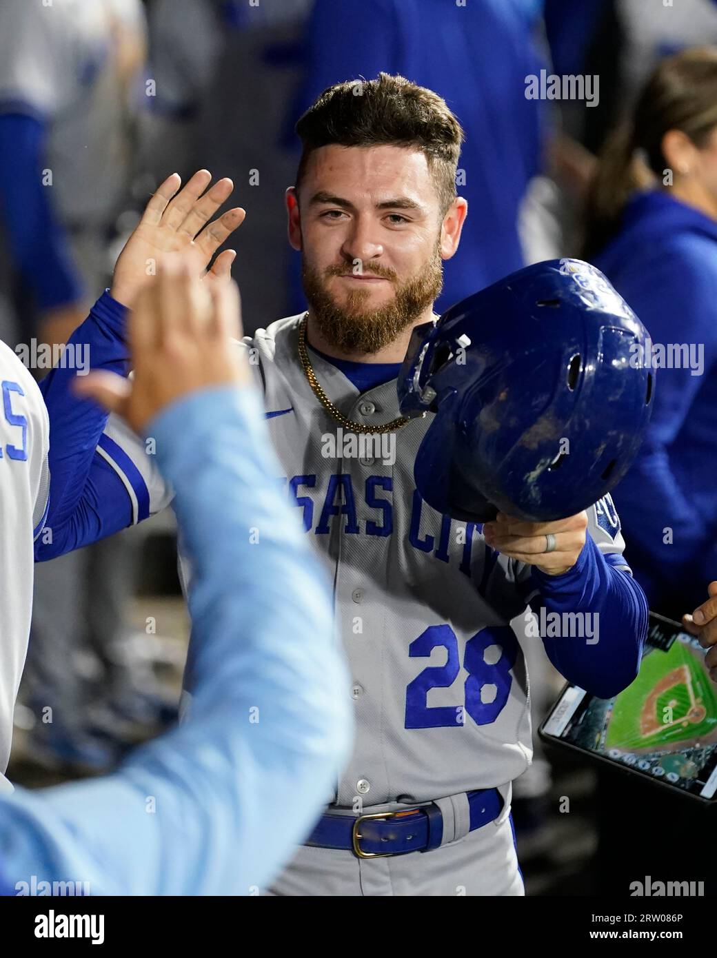 Kansas City Royals' Kyle Isbel celebrates in the dugout after scoring ...