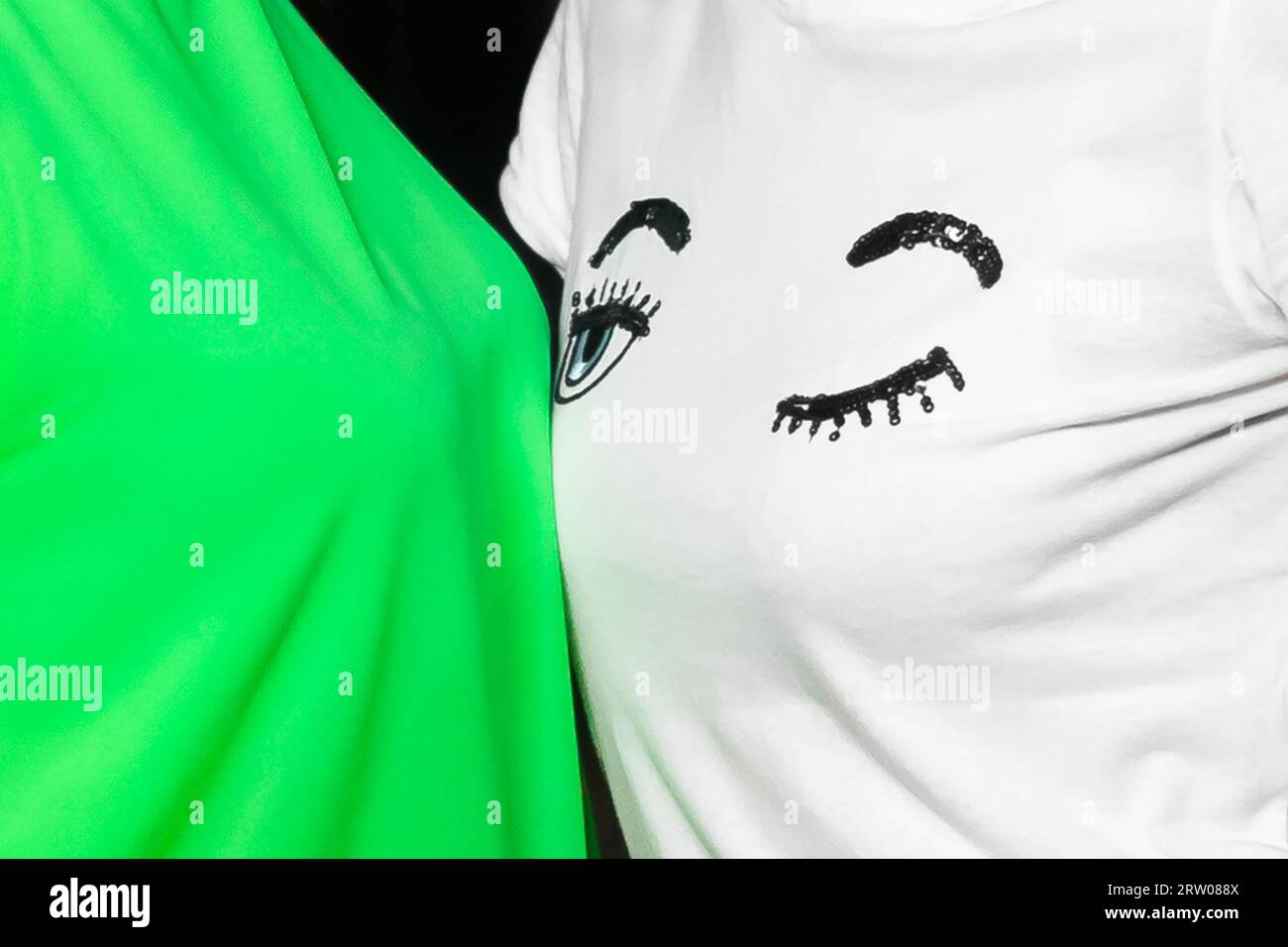 White cute T-shirt with a pattern of a winking blue eye print drawing ...