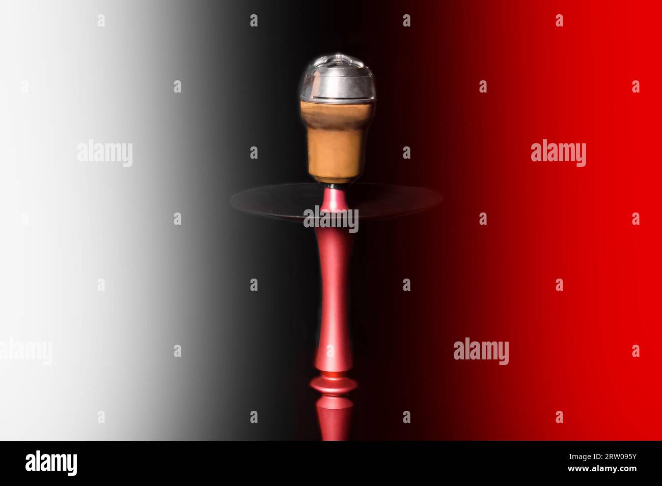 Clay object hookah head smoking on a black background in white and red ...