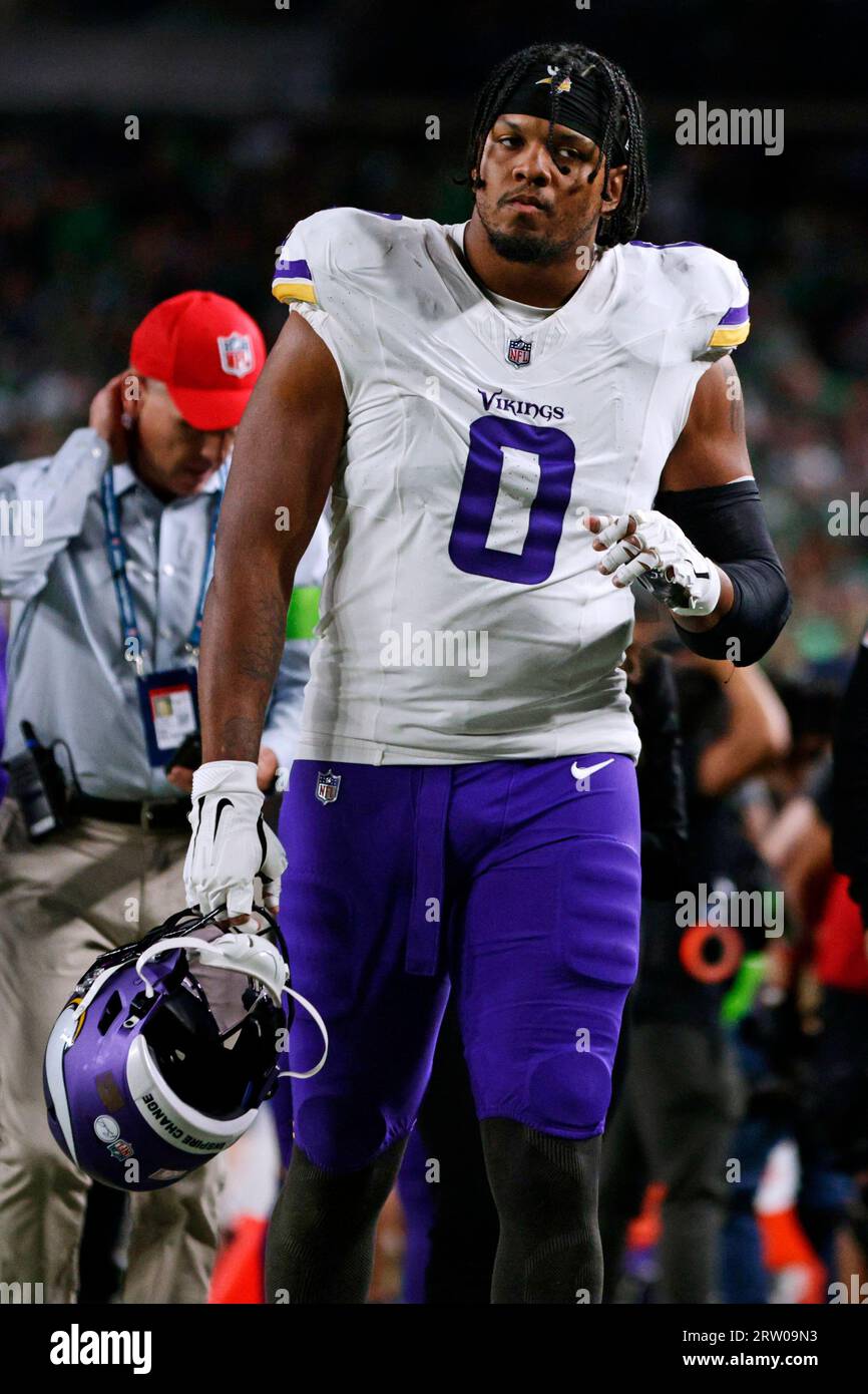 Minnesota Vikings linebacker Marcus Davenport (0) on runs off the field ...