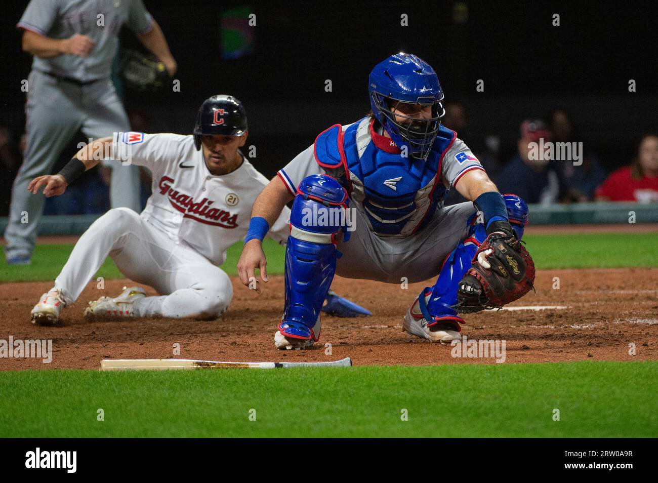 Texas Rangers' Austin Hedges takes a late throw as Cleveland Guardians ...