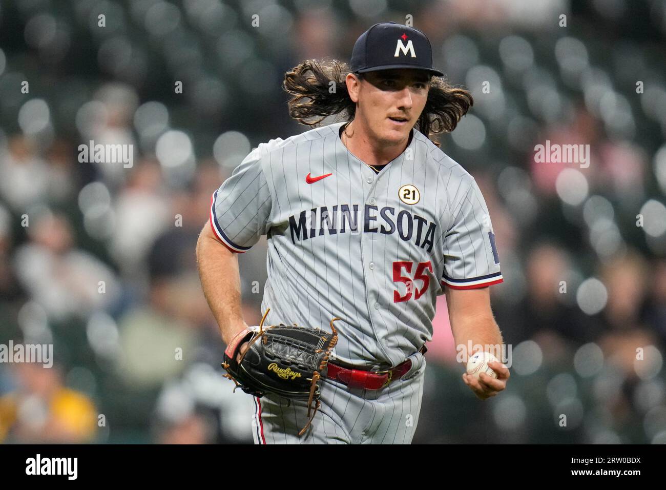 Minnesota Twins relief pitcher Kody Funderburk tosses the ball to first ...