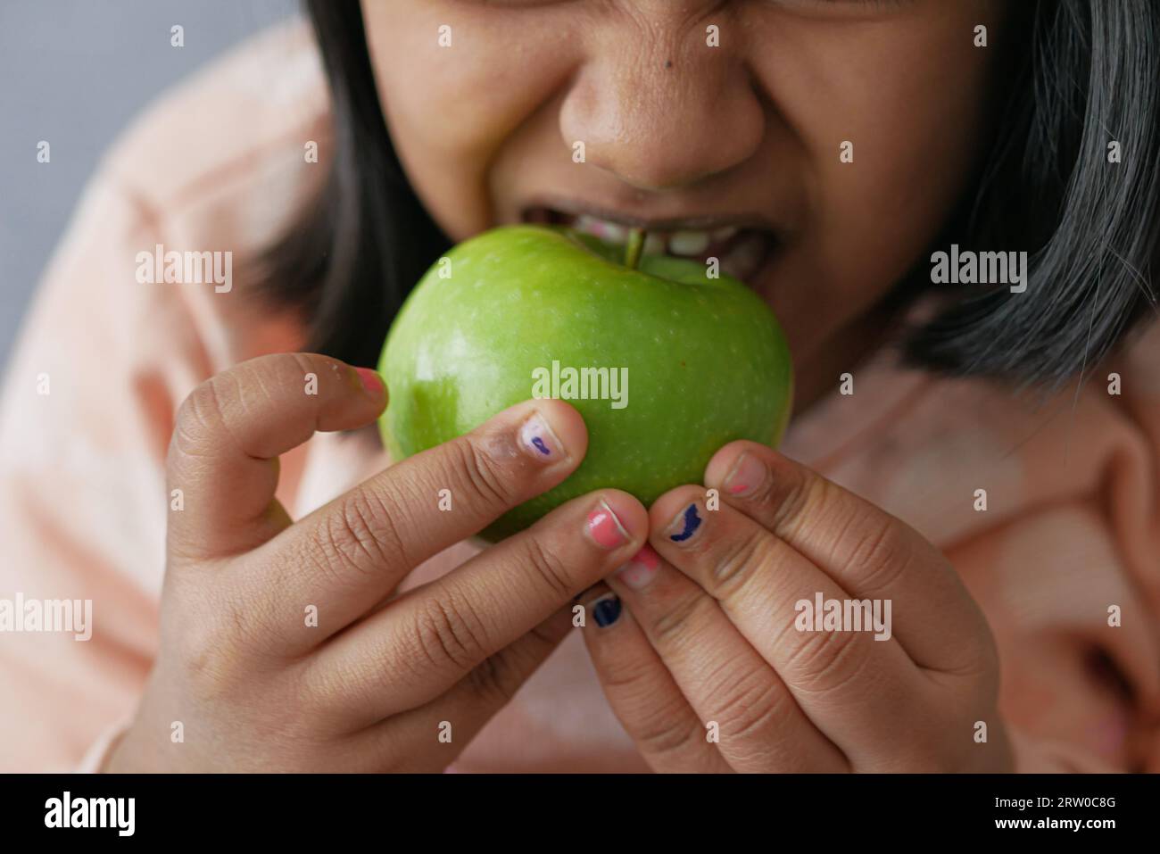 child mouth eating apple closeup Stock Photo - Alamy